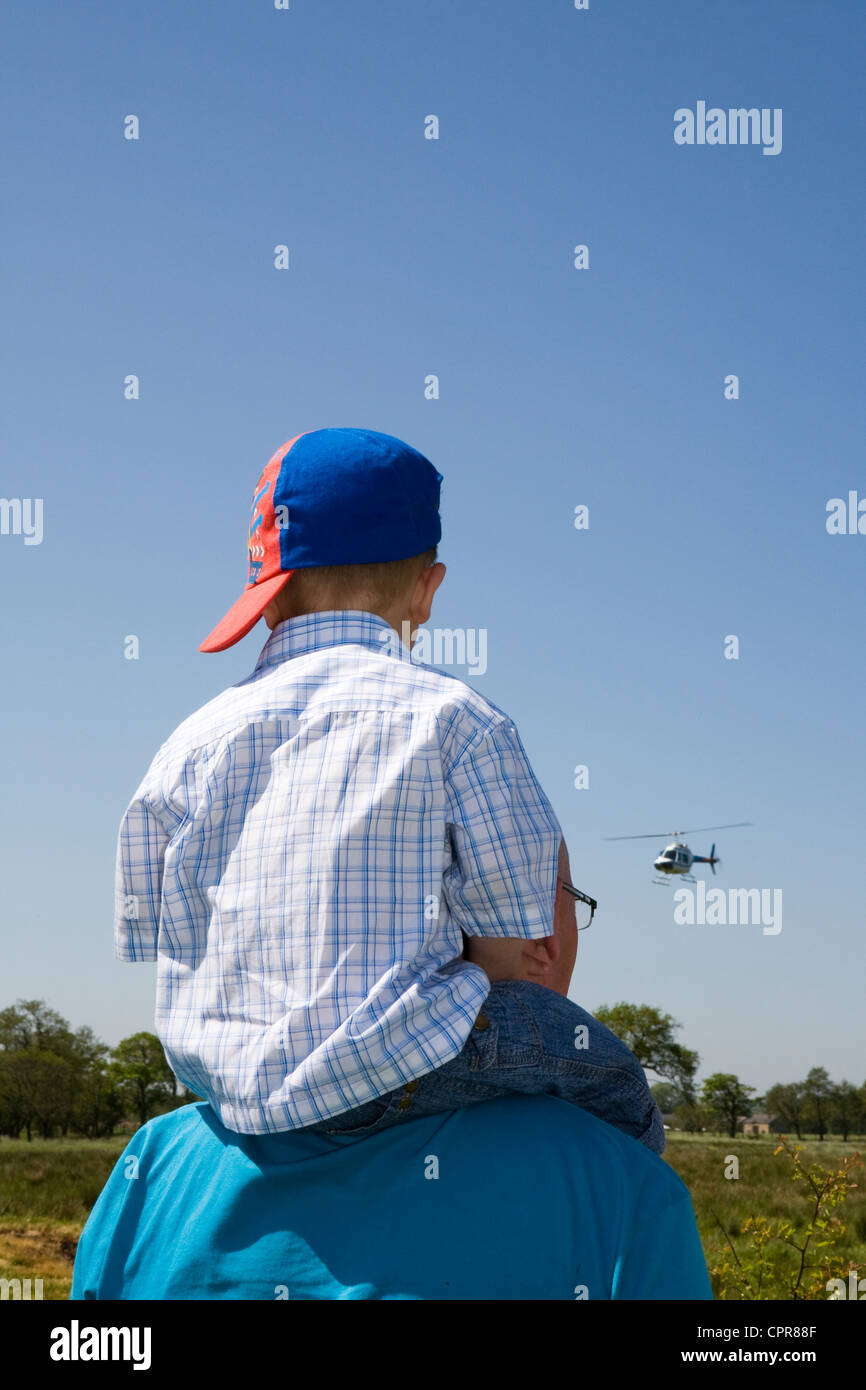 Young boy watching Help for heroes helicopter flights charity ...