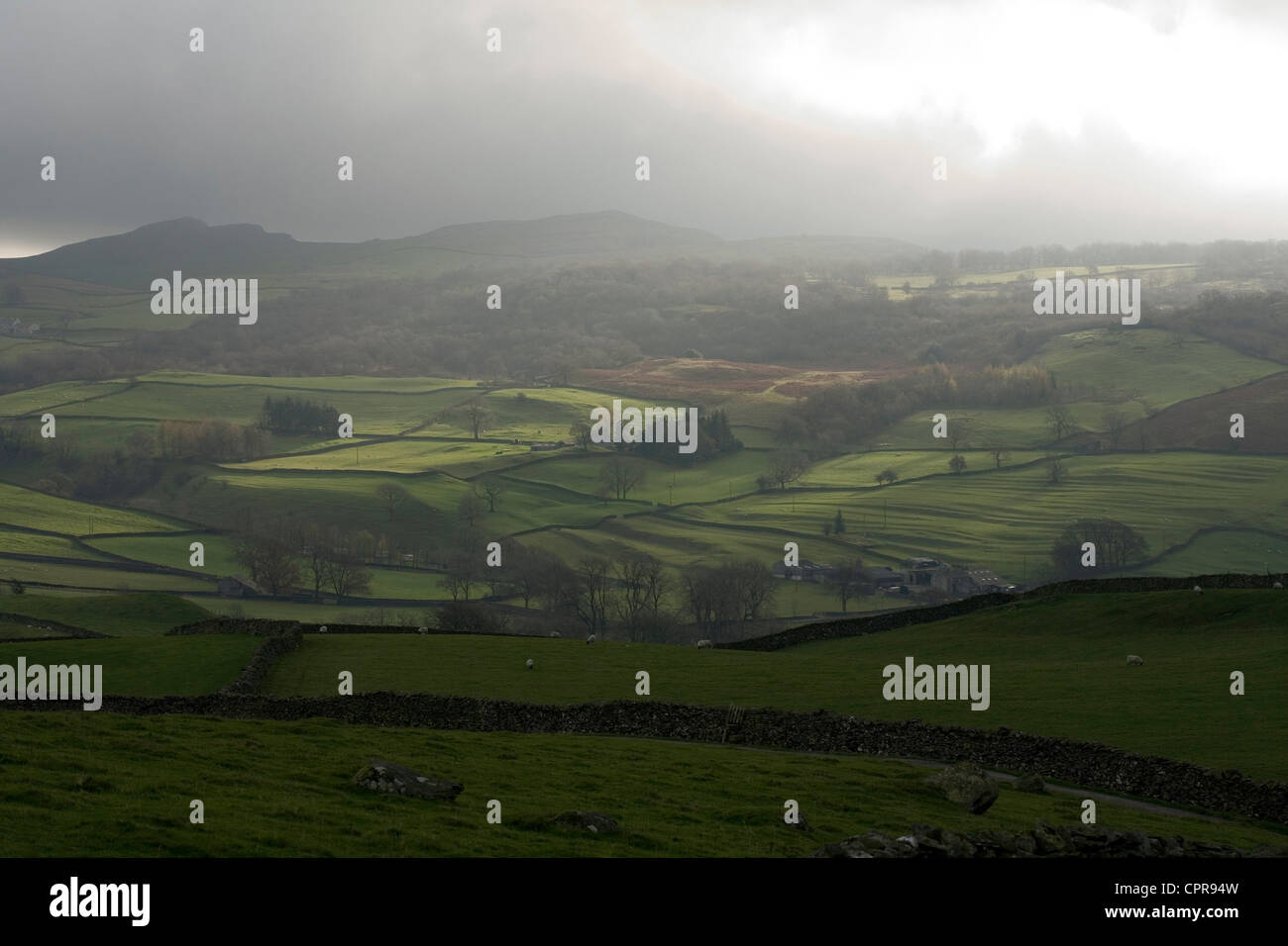 Shafts of sunlight highlighting medieval field patterns and furrows ...