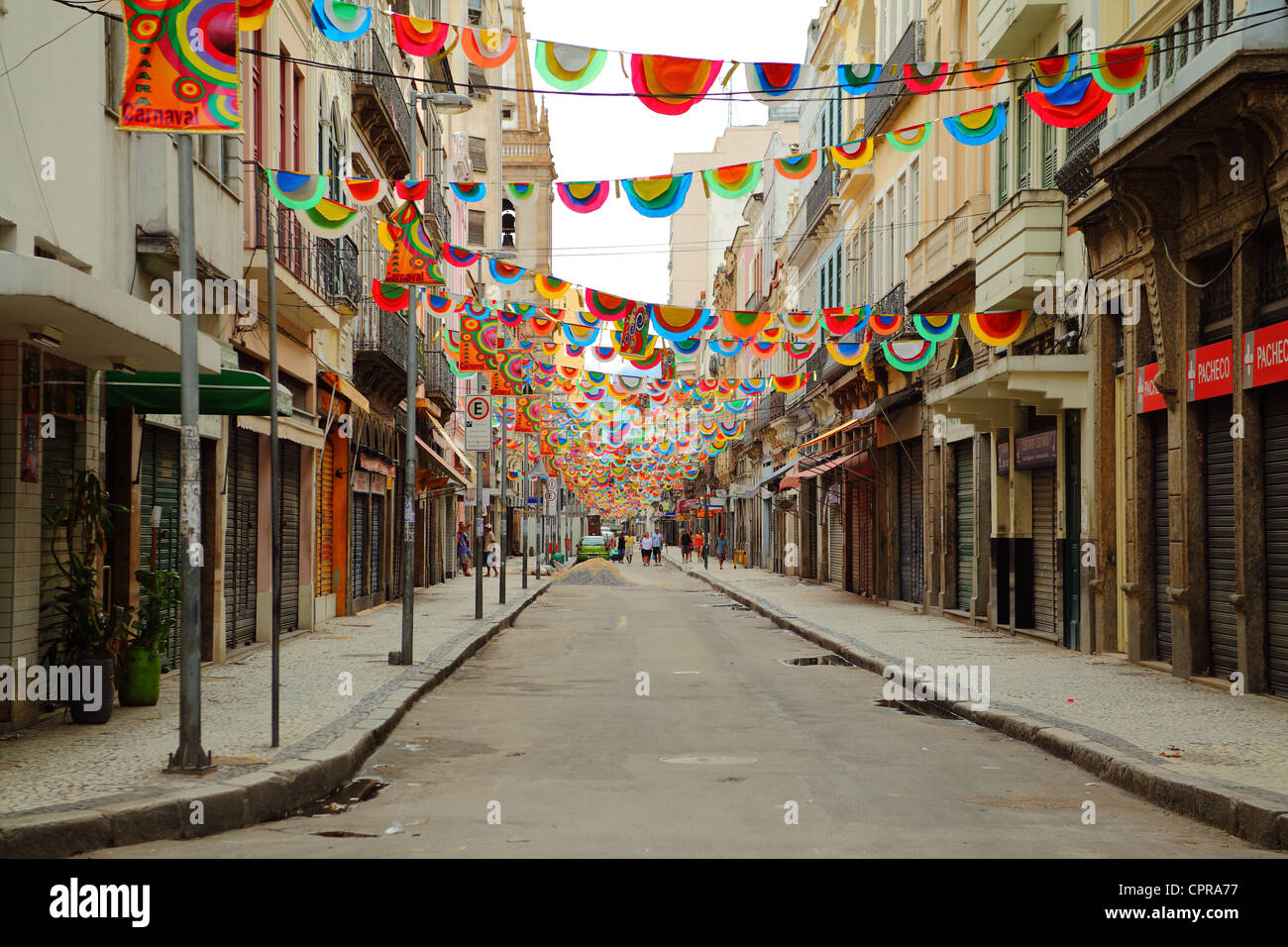 Festive banners cross an empty colonial street in Rio de Janeiro ...