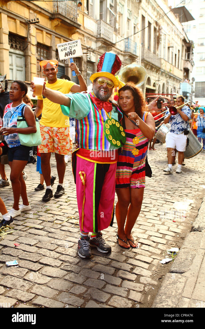 People in costume celebrating Carnival on the streets of Rio de Janeiro ...
