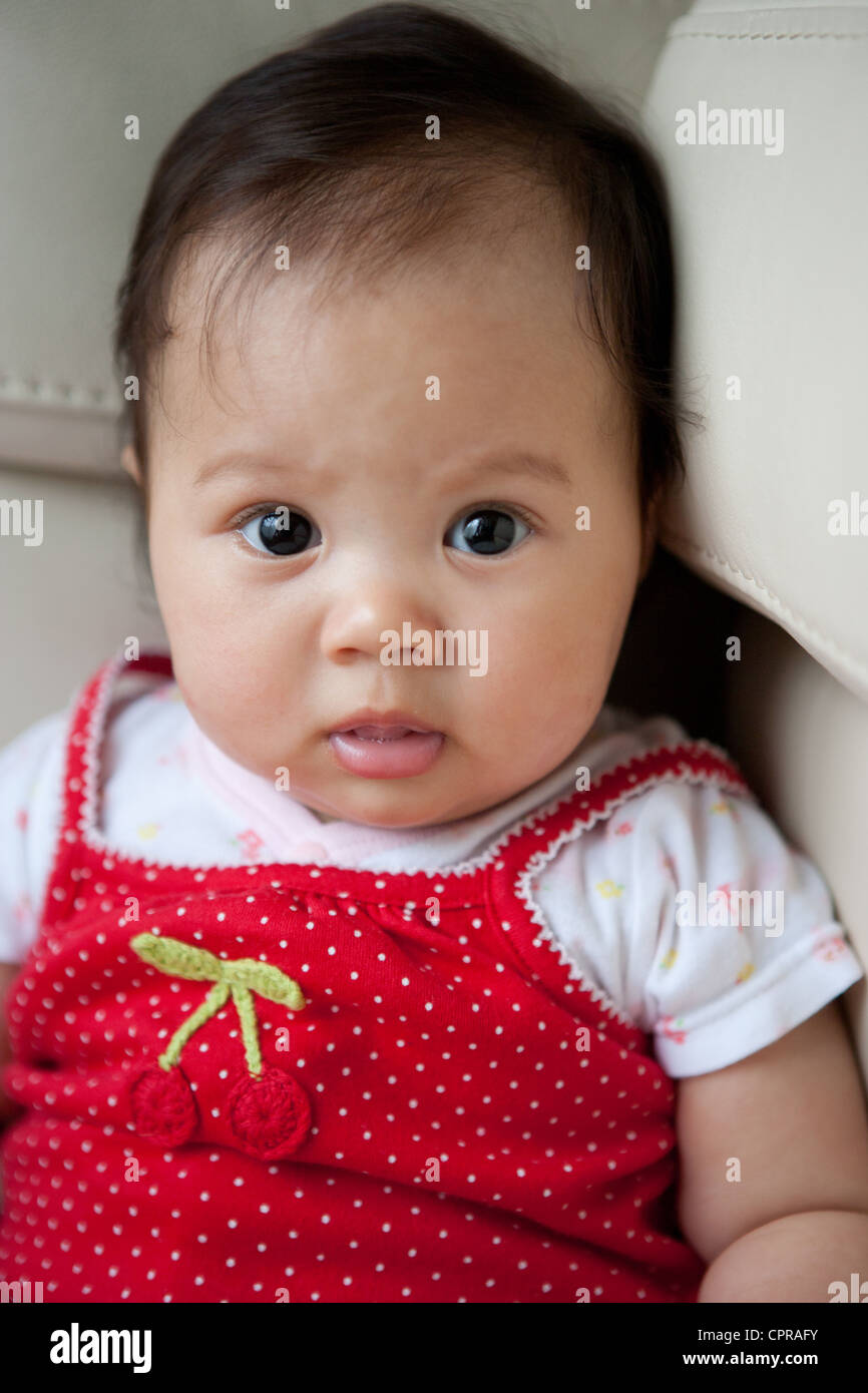 Close up of a startled five month old Japanese American baby girl ...