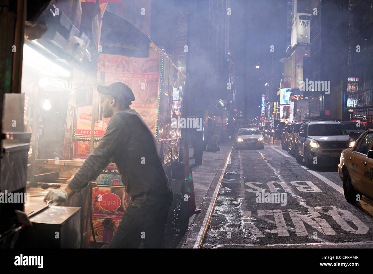 A food vendor works late at night in New York City Stock Photo - Alamy