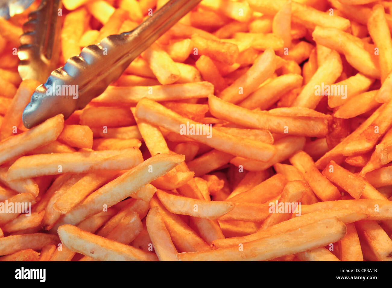 French Fries under heat lamp Stock Photo - Alamy