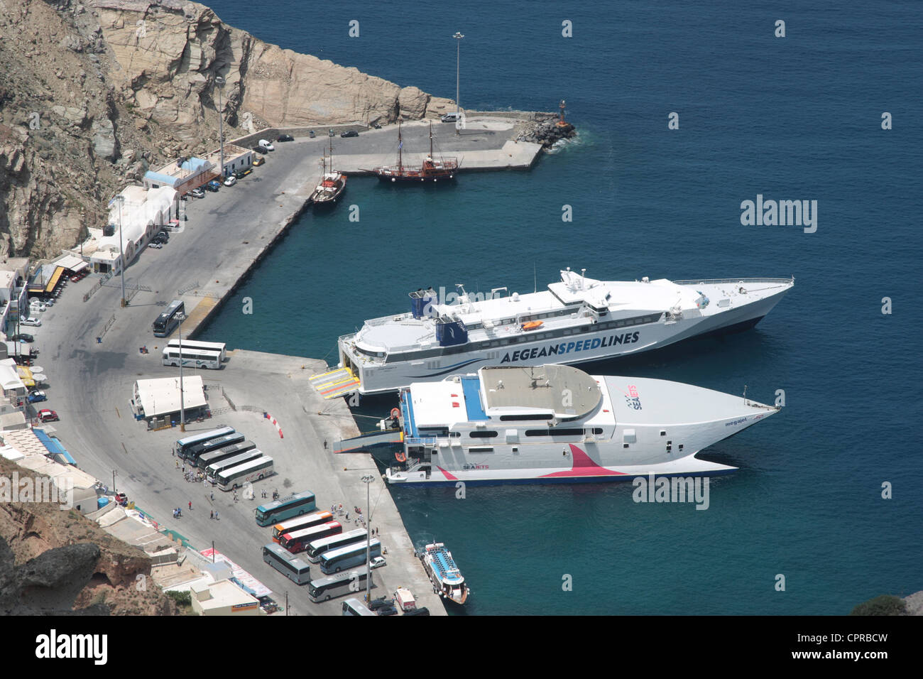Ferries serving Santorini from the port south of Thira Stock Photo - Alamy