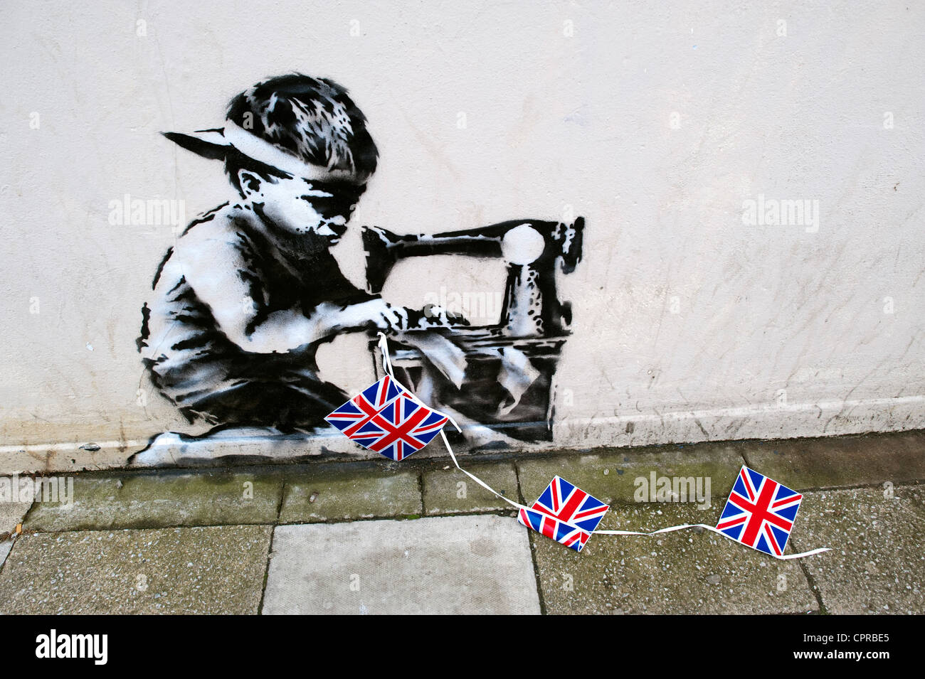 Banksy child hi-res stock photography and images - Alamy