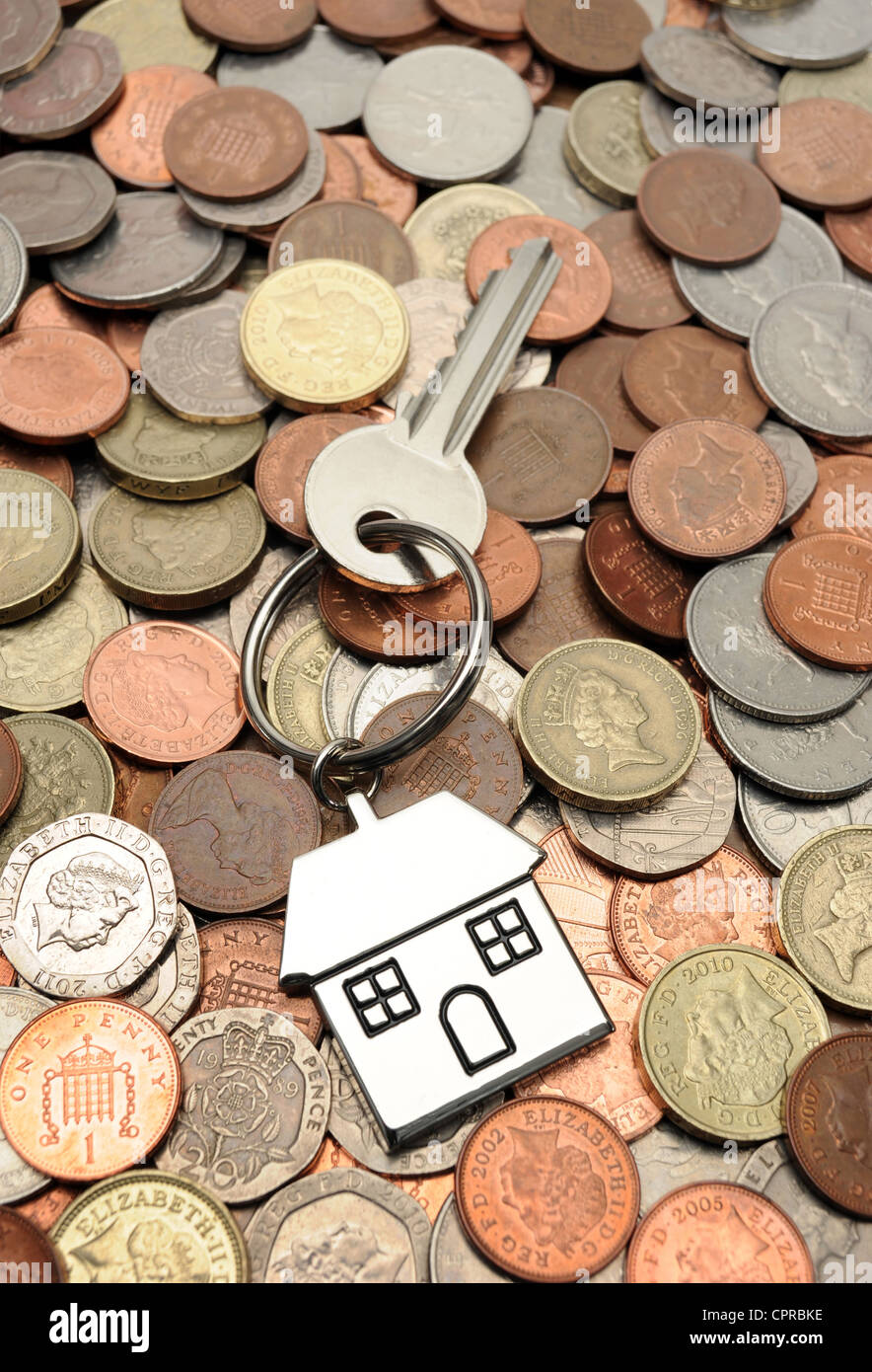 HOUSE KEY ON HOUSE KEYRING WITH BRITISH MONEY RE HOUSING COSTS BUYING ...