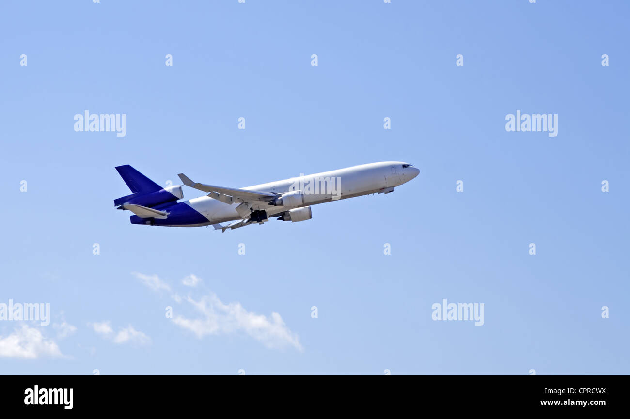 Fast airplane in flight over the blue sky Stock Photo - Alamy