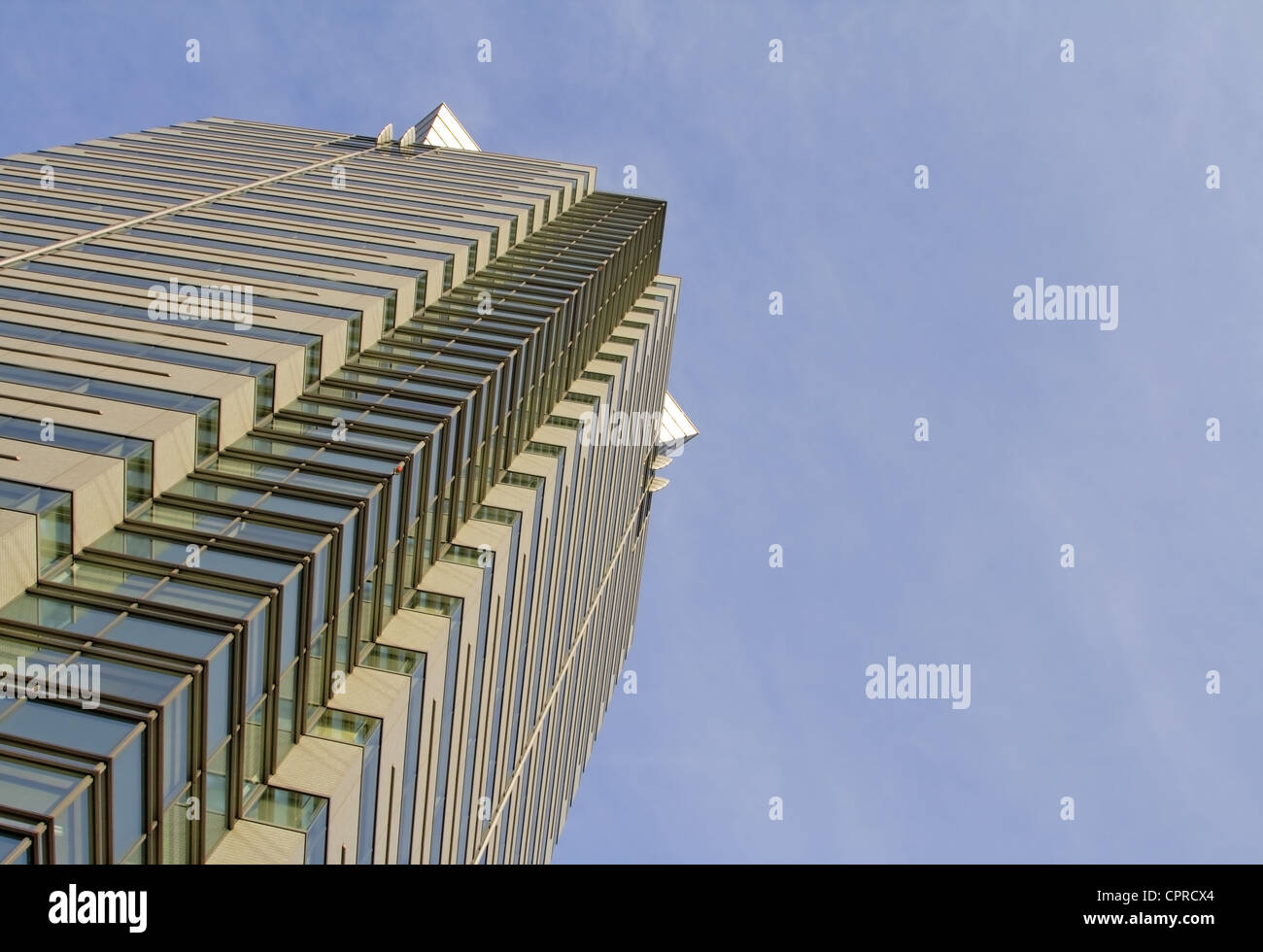 Down-up perspective near a modern skyscraper Stock Photo - Alamy