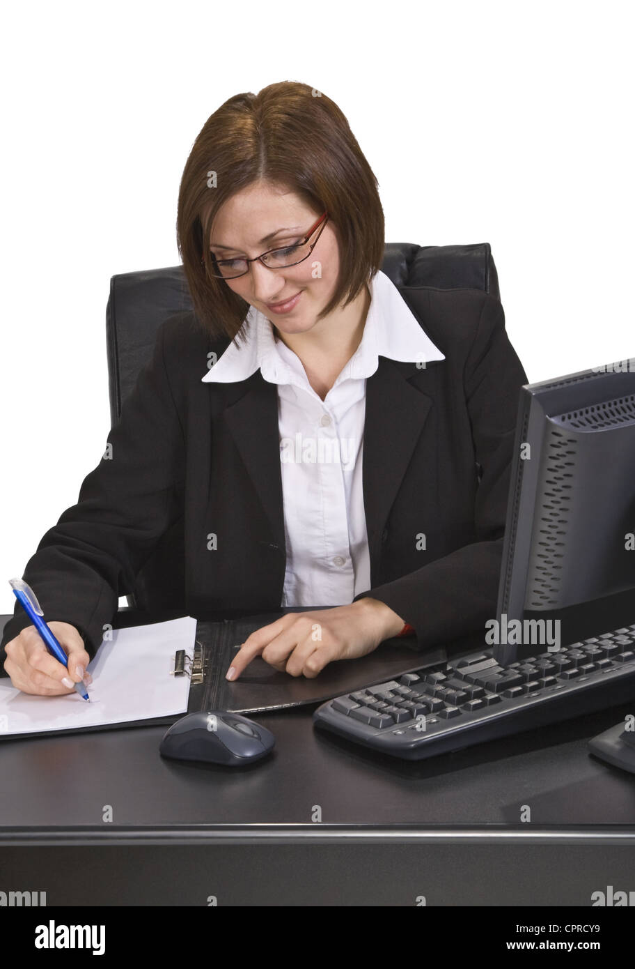 Smiling businesswoman taking notes at her desk Stock Photo - Alamy