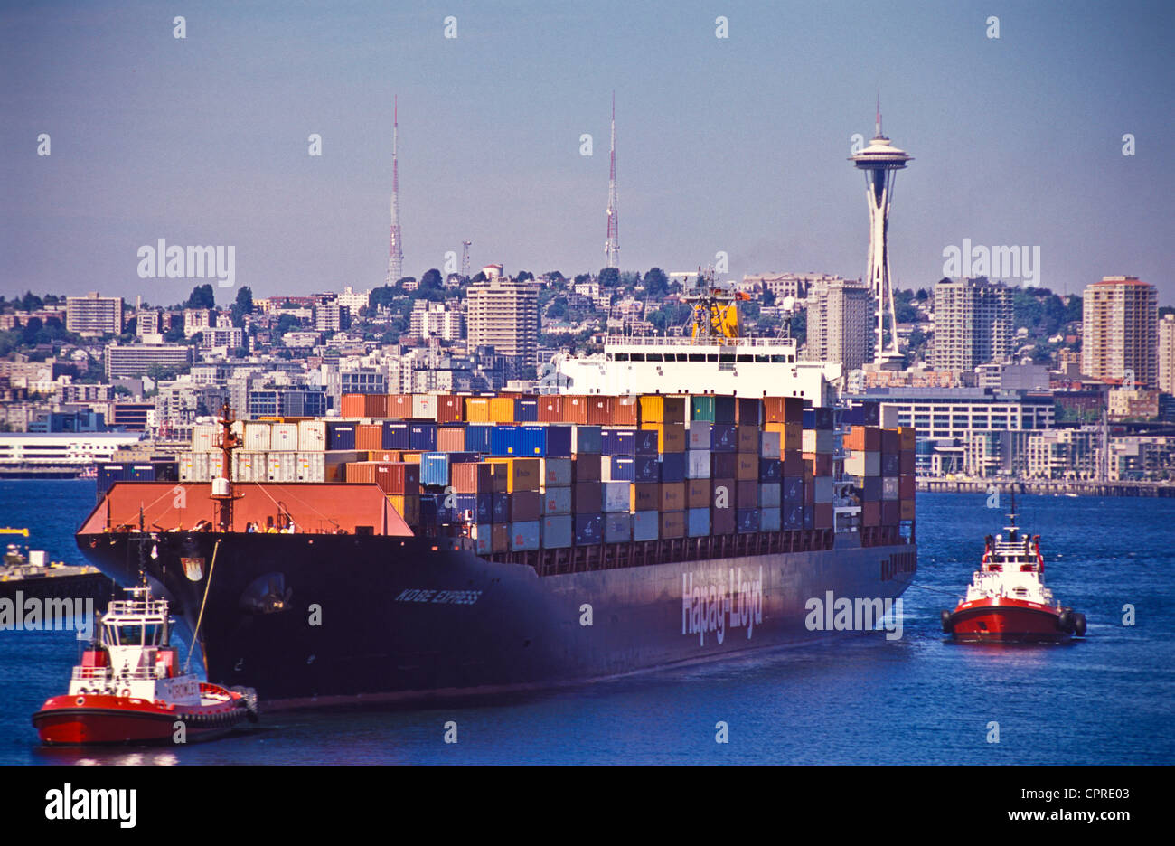 Space Needle tower, Seattle, Washington state shipping port . Tug boats ...