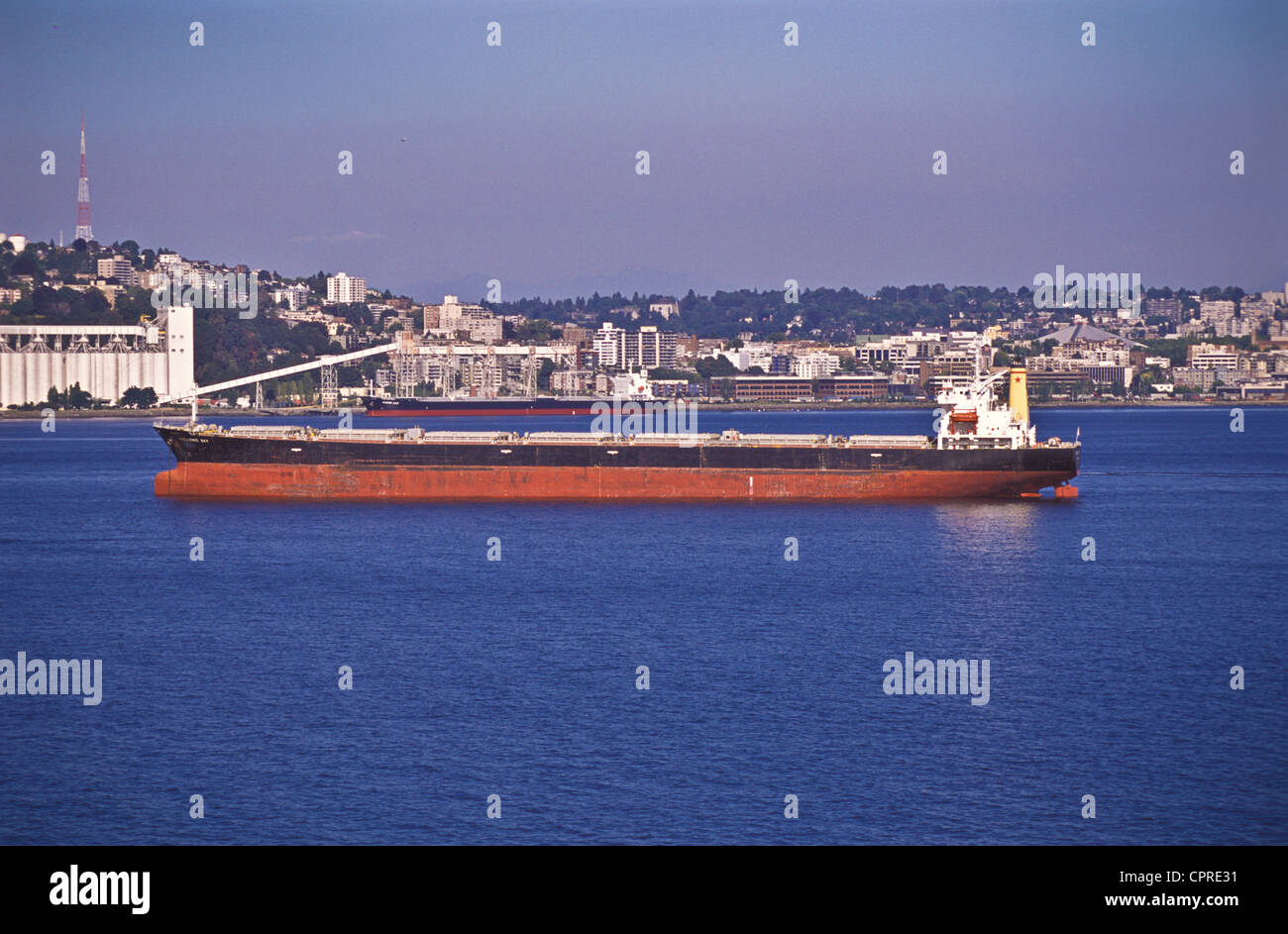 Space Needle tower, Seattle, Washington state shipping port . Tug boats ...