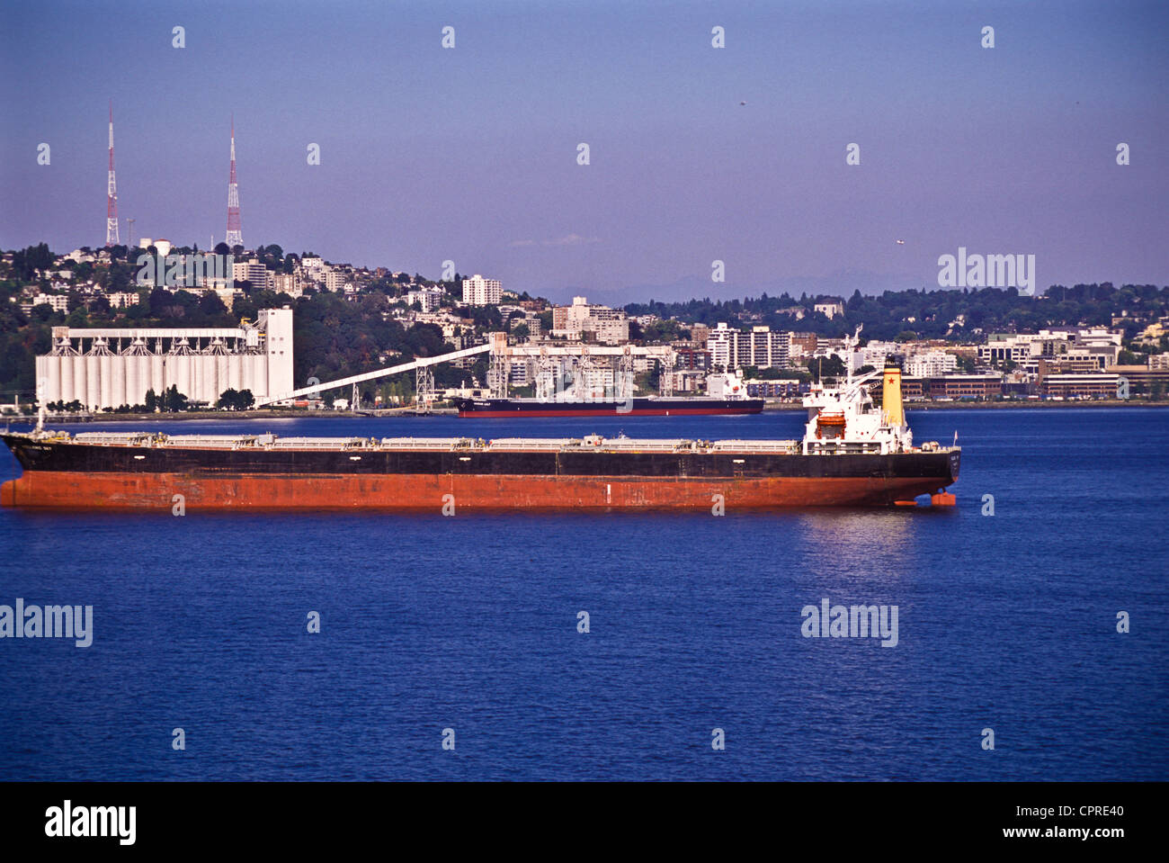 Space Needle tower, Seattle, Washington state shipping port . Tug boats ...