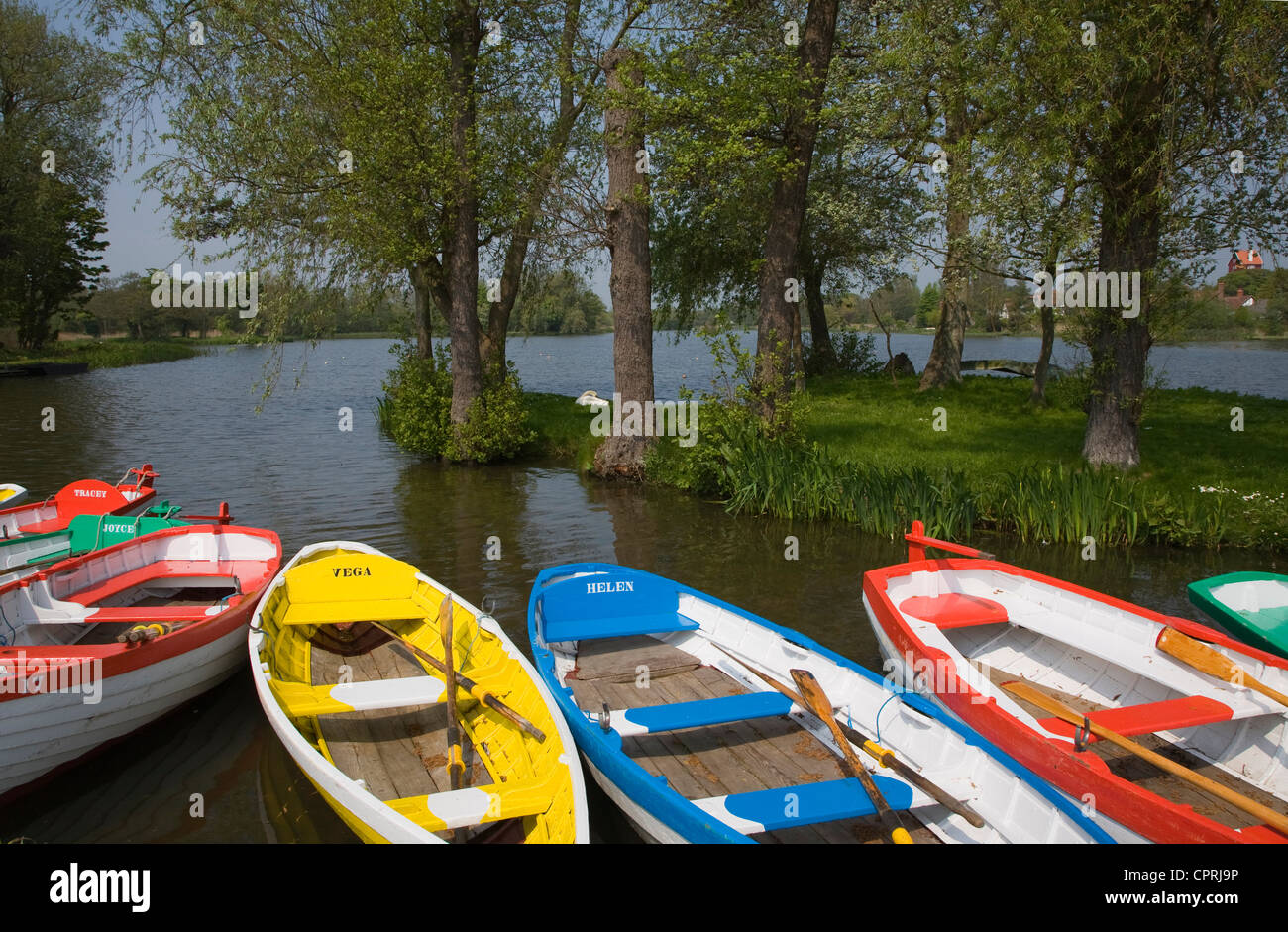 Colourful rowing boats on the Meare boating lake, Thorpeness, Suffolk ...