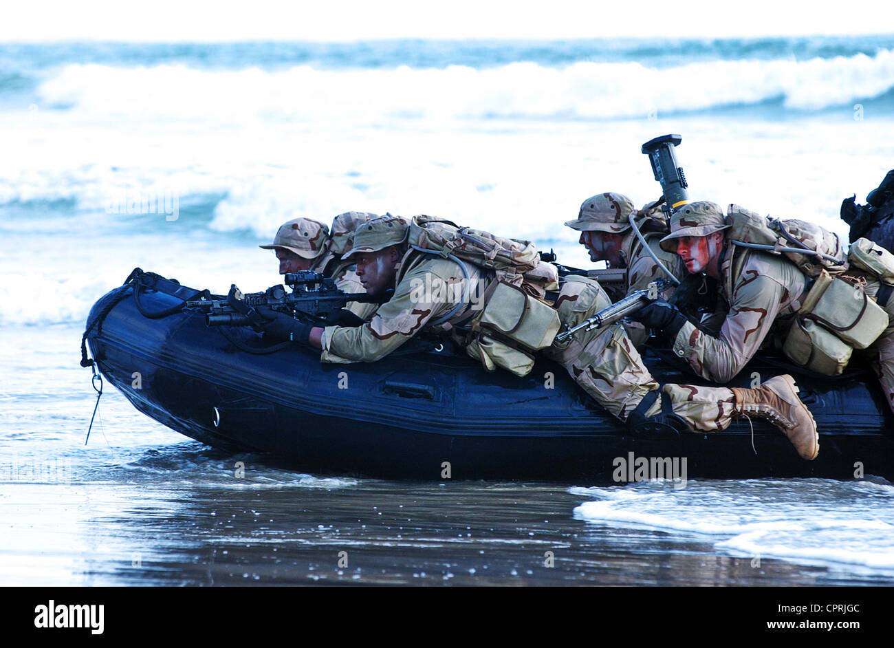 US Navy SEALs practice beach landings during combat training Stock ...