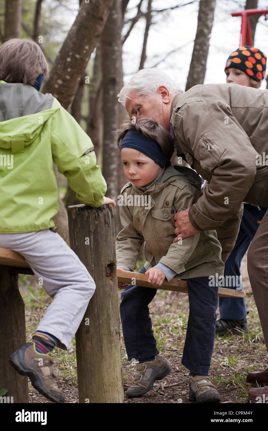 Family at the playground Stock Photo - Alamy