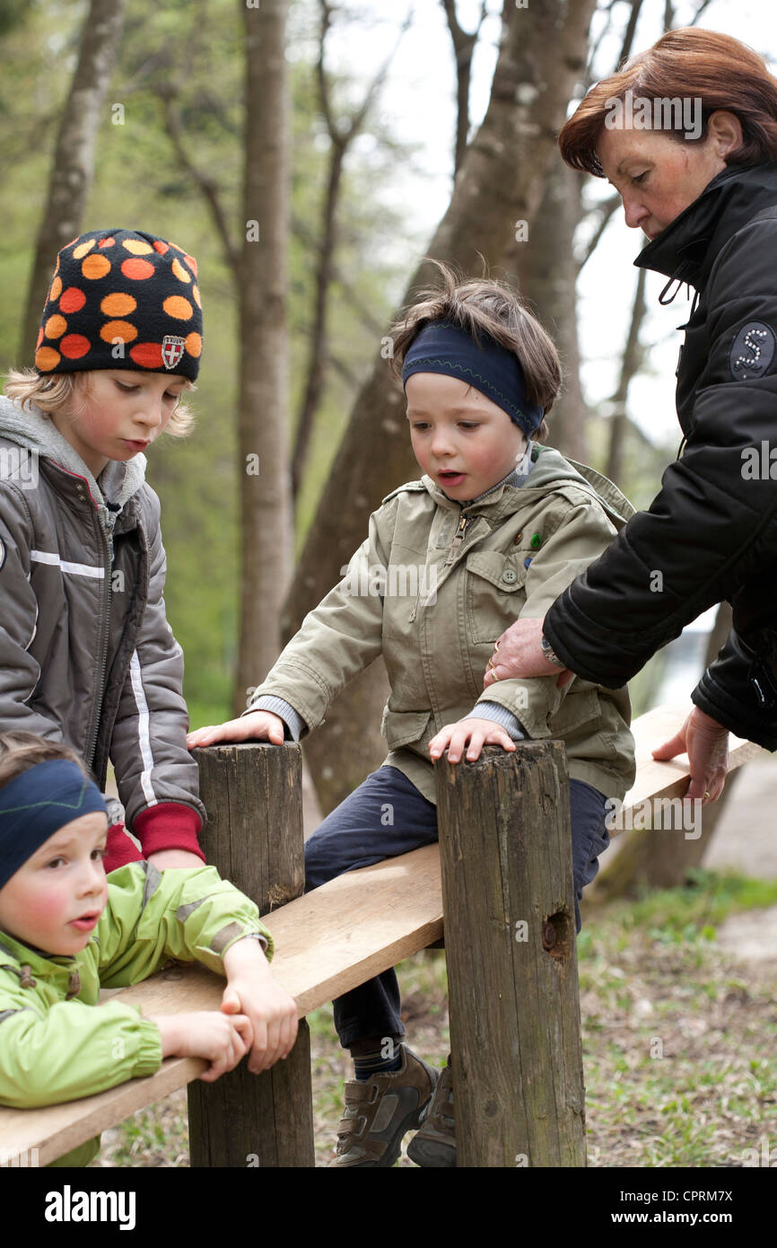 Family at the playground Stock Photo - Alamy