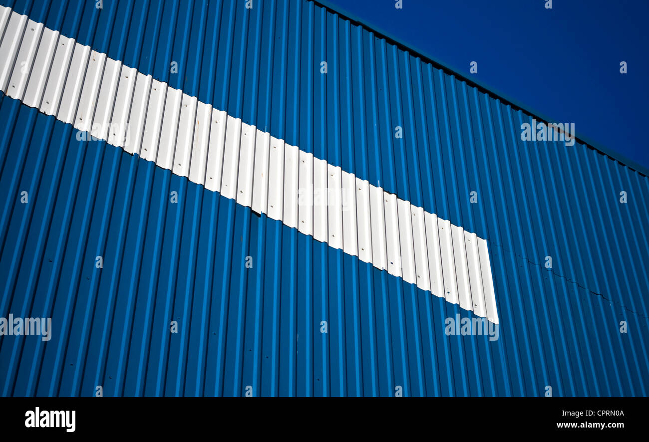 Blue and white painted ridged metal wall texture Stock Photo - Alamy