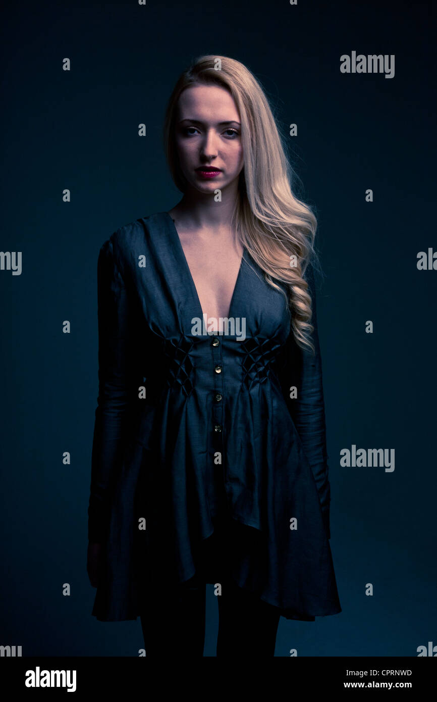 blonde girl in low key lighting Stock Photo - Alamy