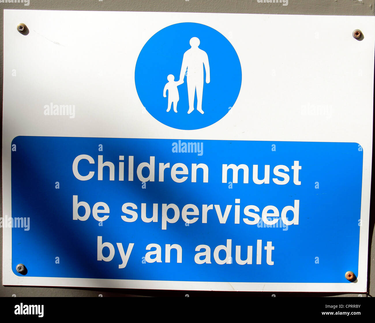 "Children must be supervised by an adult" sign Stock Photo - Alamy