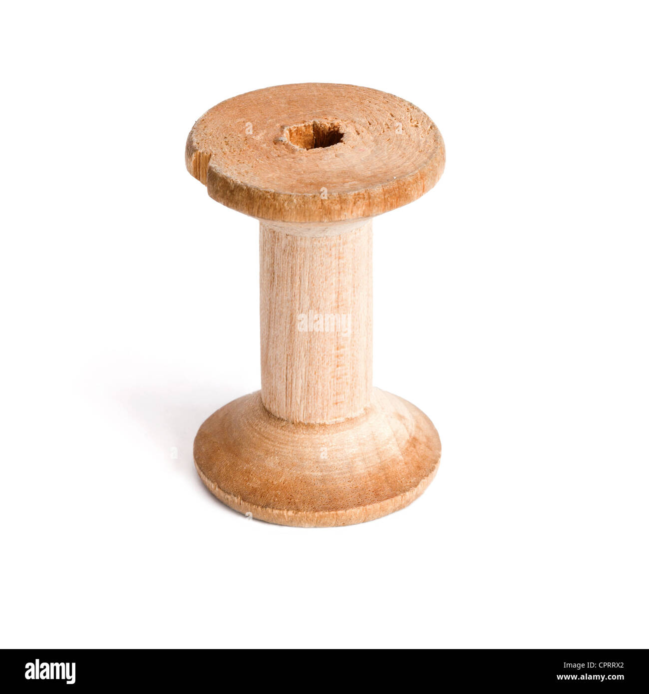 Old wooden empty reel of thread on white background Stock Photo - Alamy