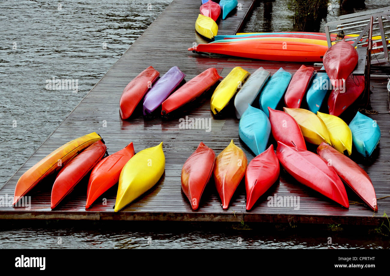 Colorful canoes on the dock Stock Photo - Alamy