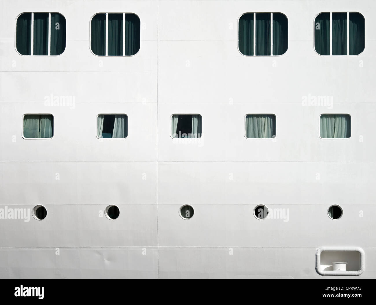 Background texture photo of white ship's hull with windows and ...