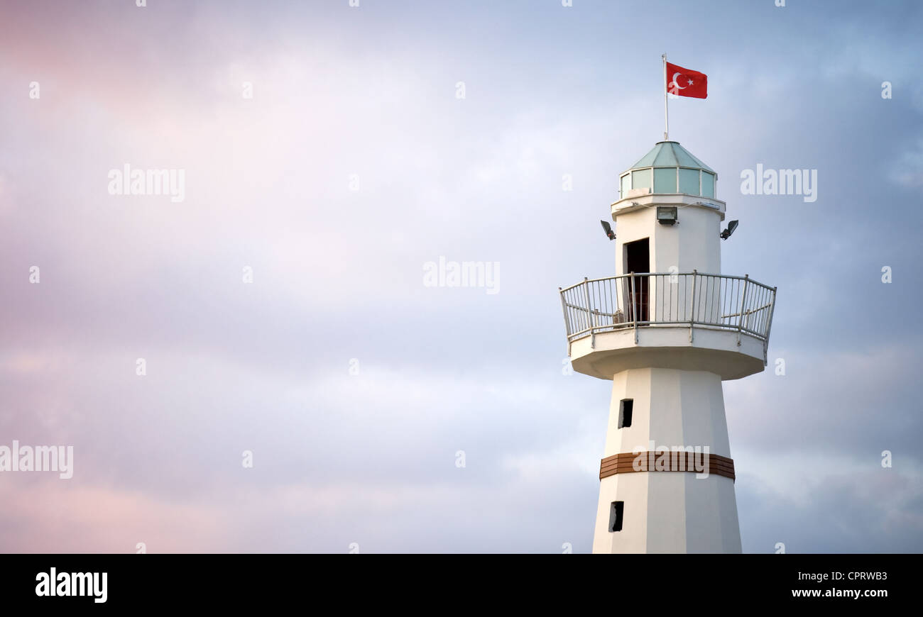 Upper part of white Lighthouse with Turkish flag on top Stock Photo - Alamy
