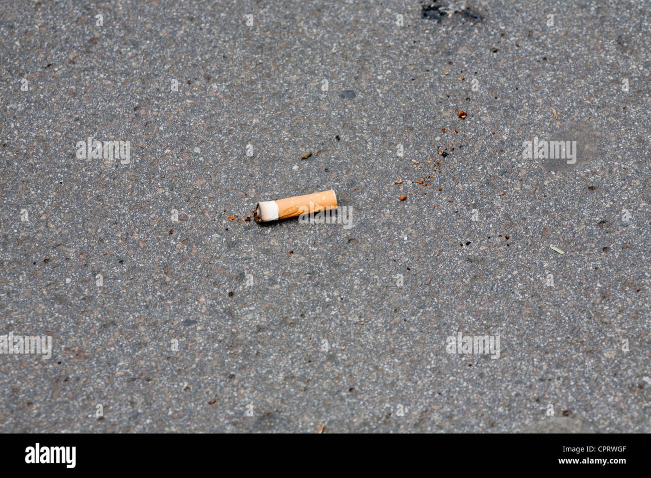 cigarette stub on the ground Stock Photo - Alamy