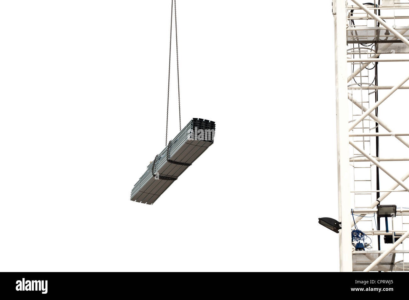Crane lifting metal blocks up Stock Photo - Alamy