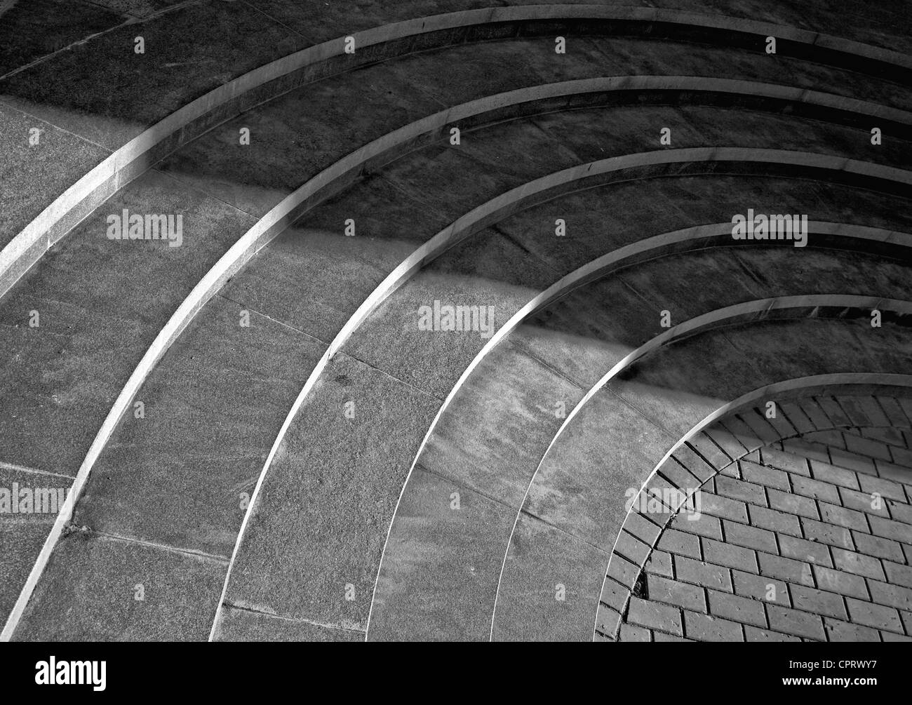 Six curved footsteps made of stone with shadow walking across it Stock ...