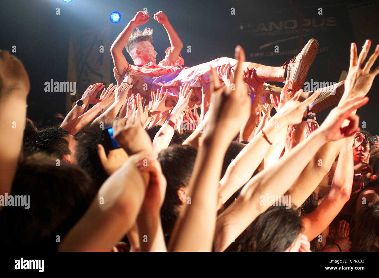 Shen Zijun, drummer of Chinese metal quartet Voodoo Kungfu, is held by ...