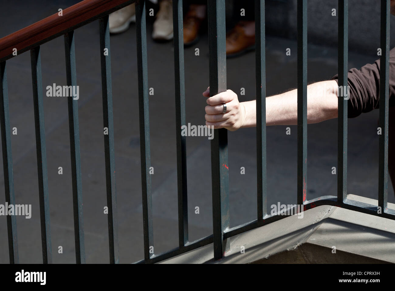 Hand on a rail Stock Photo - Alamy