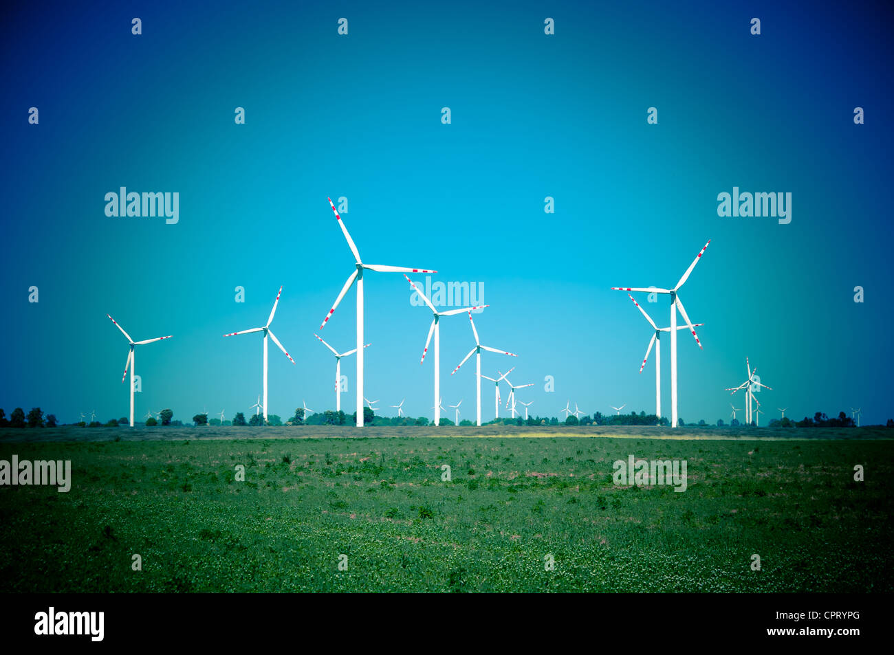 Wind turbine farm on rural terrain Stock Photo - Alamy