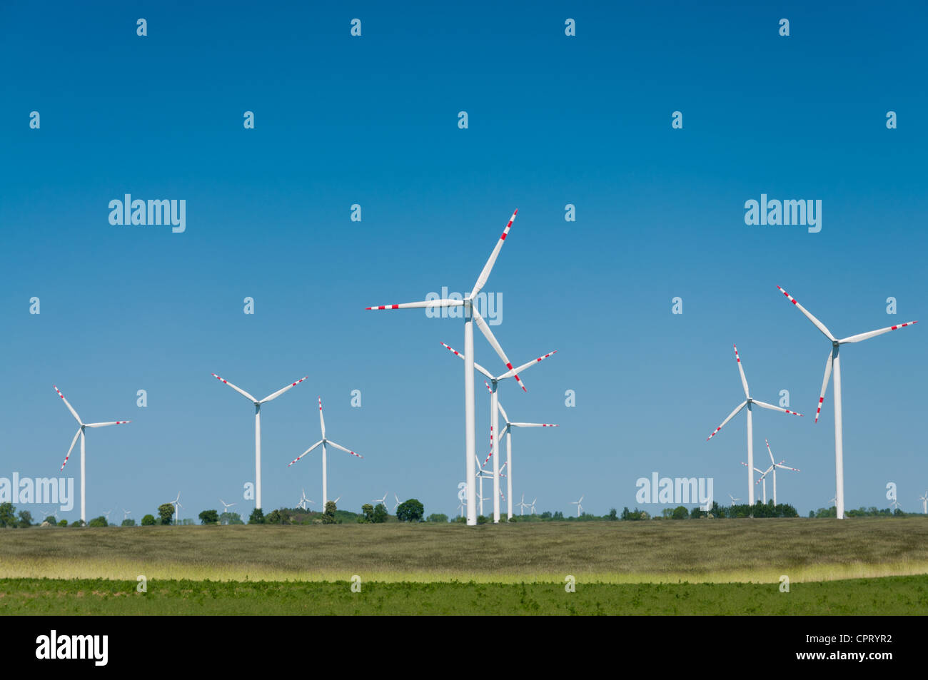 Wind turbine farm on rural terrain Stock Photo - Alamy