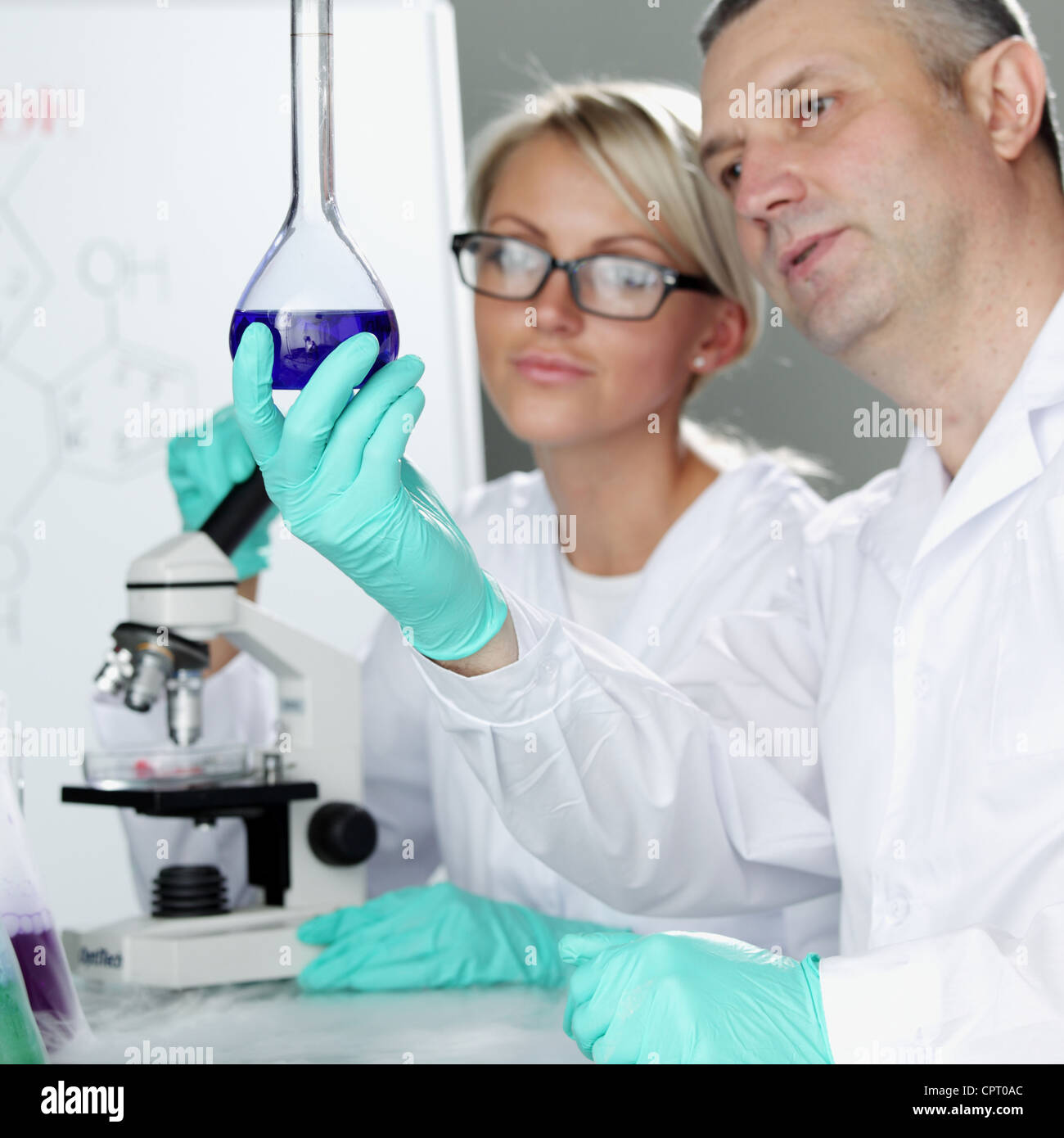 two scientist in chemical lab conducting experiments Stock Photo - Alamy