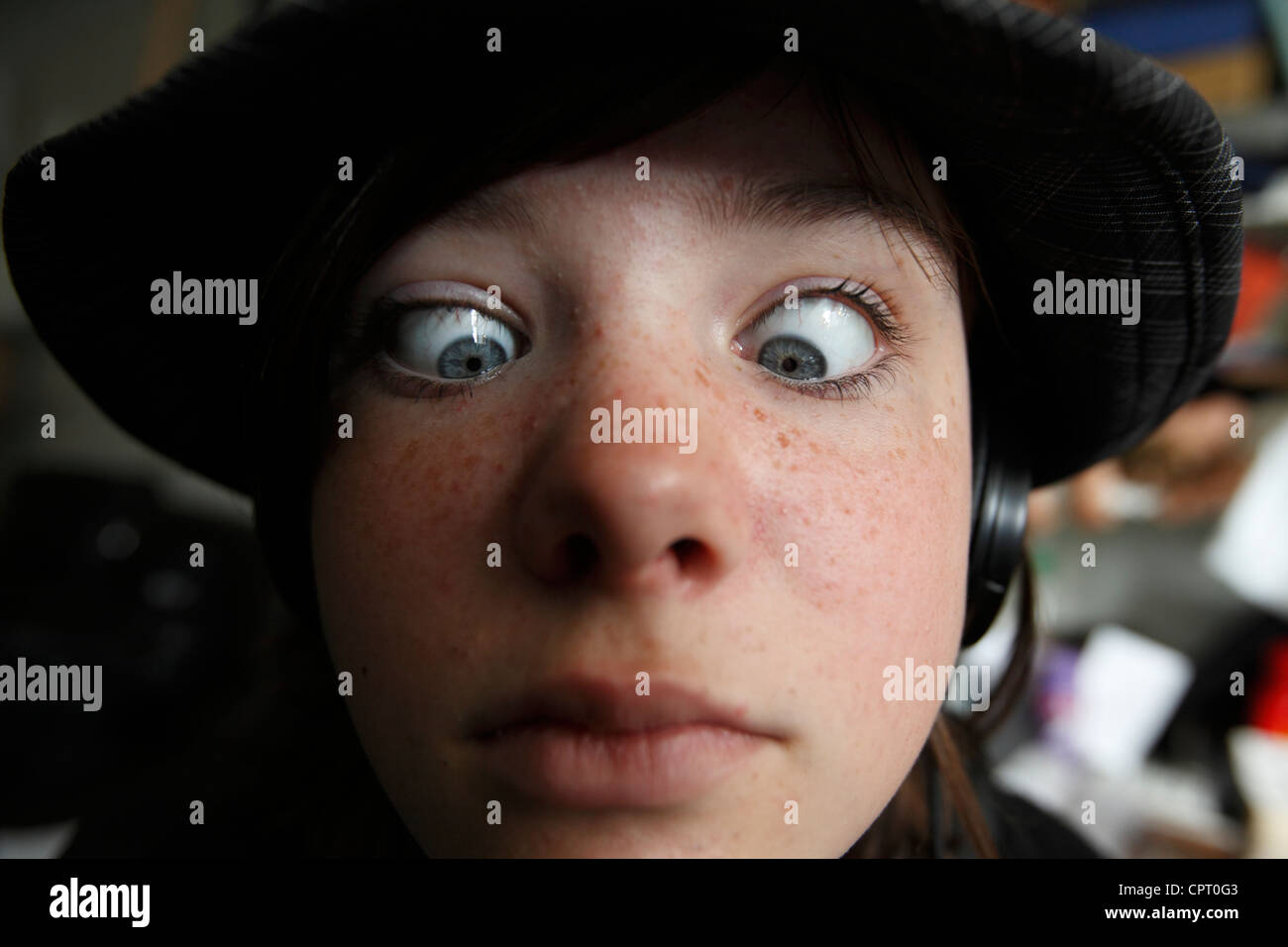 Girl with crossed eyes Stock Photo - Alamy