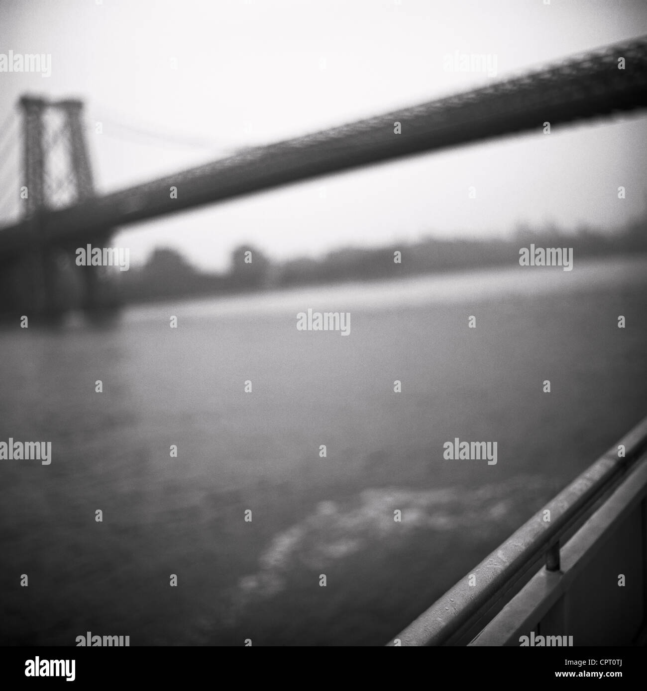 Williamsburg Bridge and wet railing on boat, New York, NY Stock Photo ...