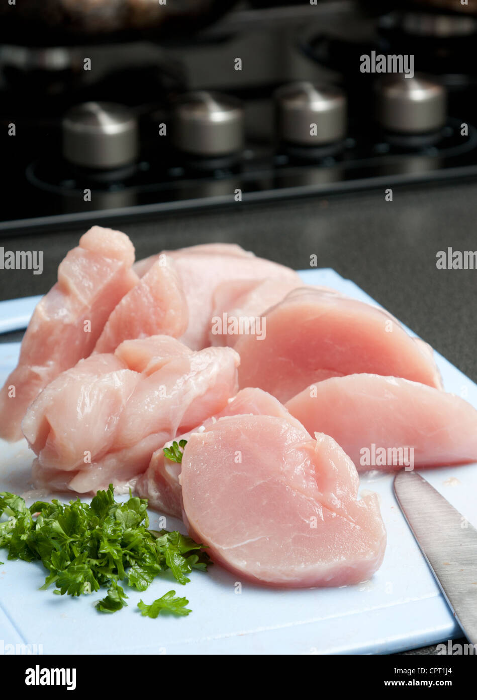 Diced healthy lean chicken pieces Stock Photo - Alamy