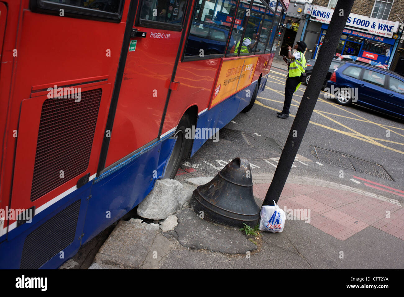 A London bus in the aftermath of striking a kerb stone in a King's ...