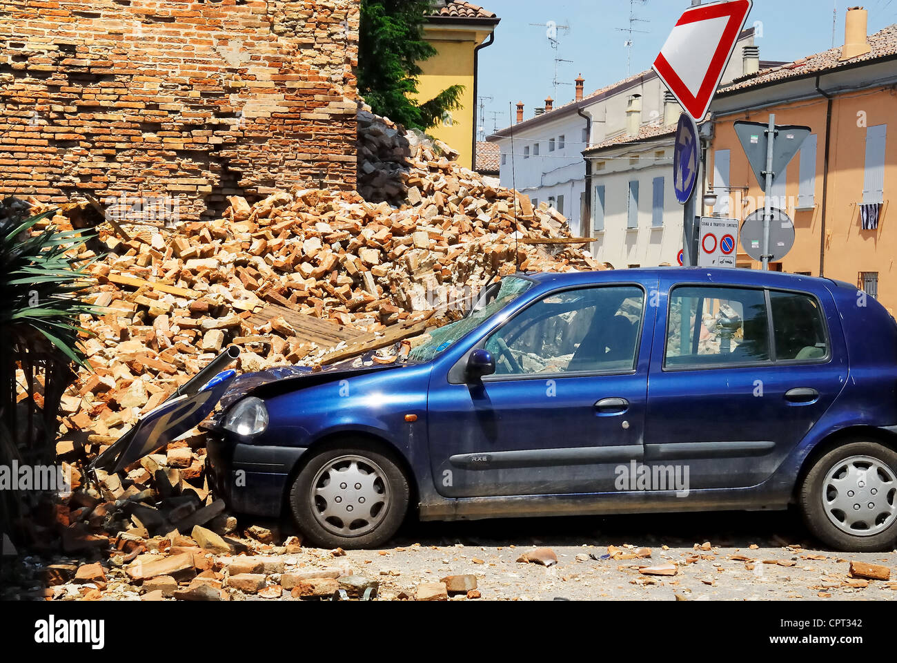 Earthquake in Northern Italy. A car under the rubble in Finale Emilia ...