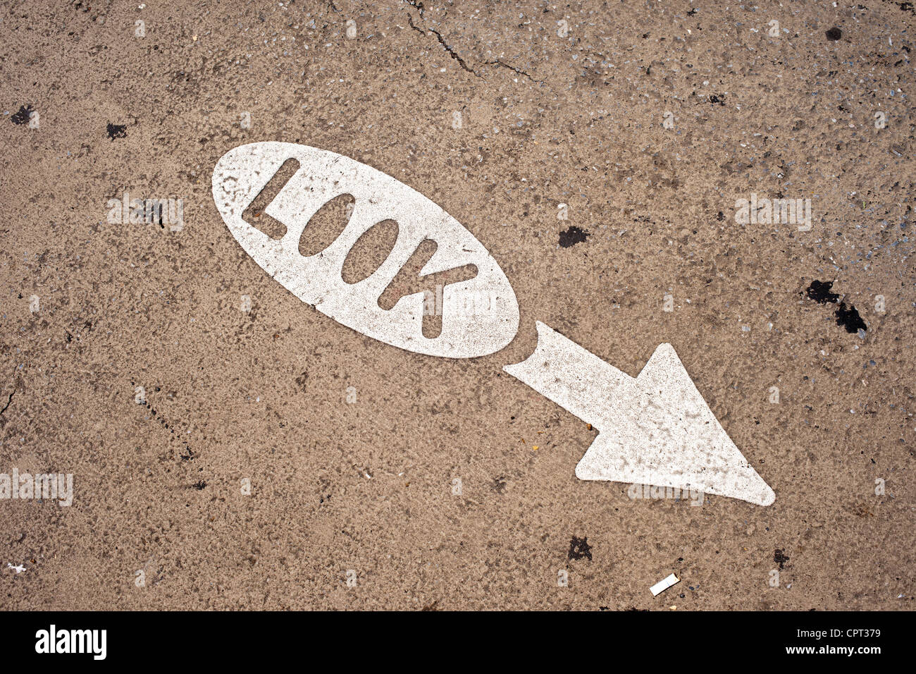 A directional sign on a sidewalk in New York informs pedestrians of the ...