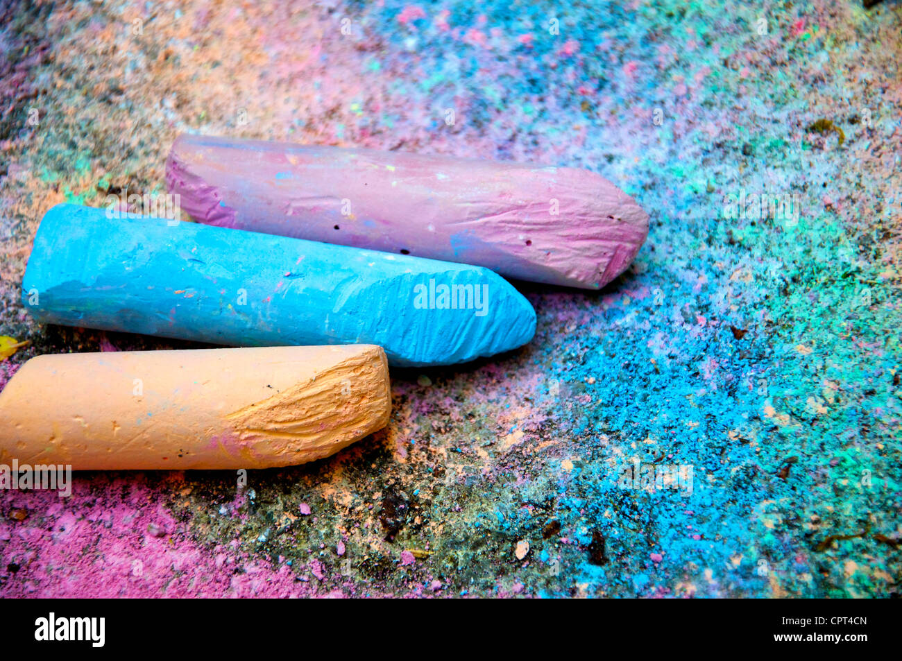 Pieces of colorful chalk on the painted pavement Stock Photo - Alamy