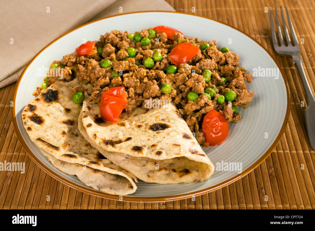 Plated meal of lamb keema matar with chapatis Stock Photo - Alamy