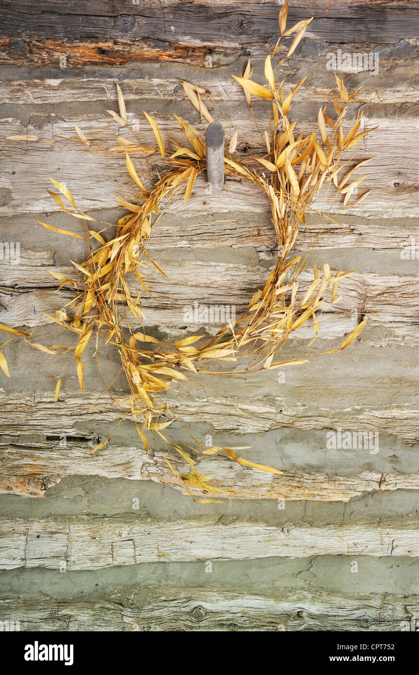 Dried hay wreath on log cabin wall, Texas, USA Stock Photo - Alamy