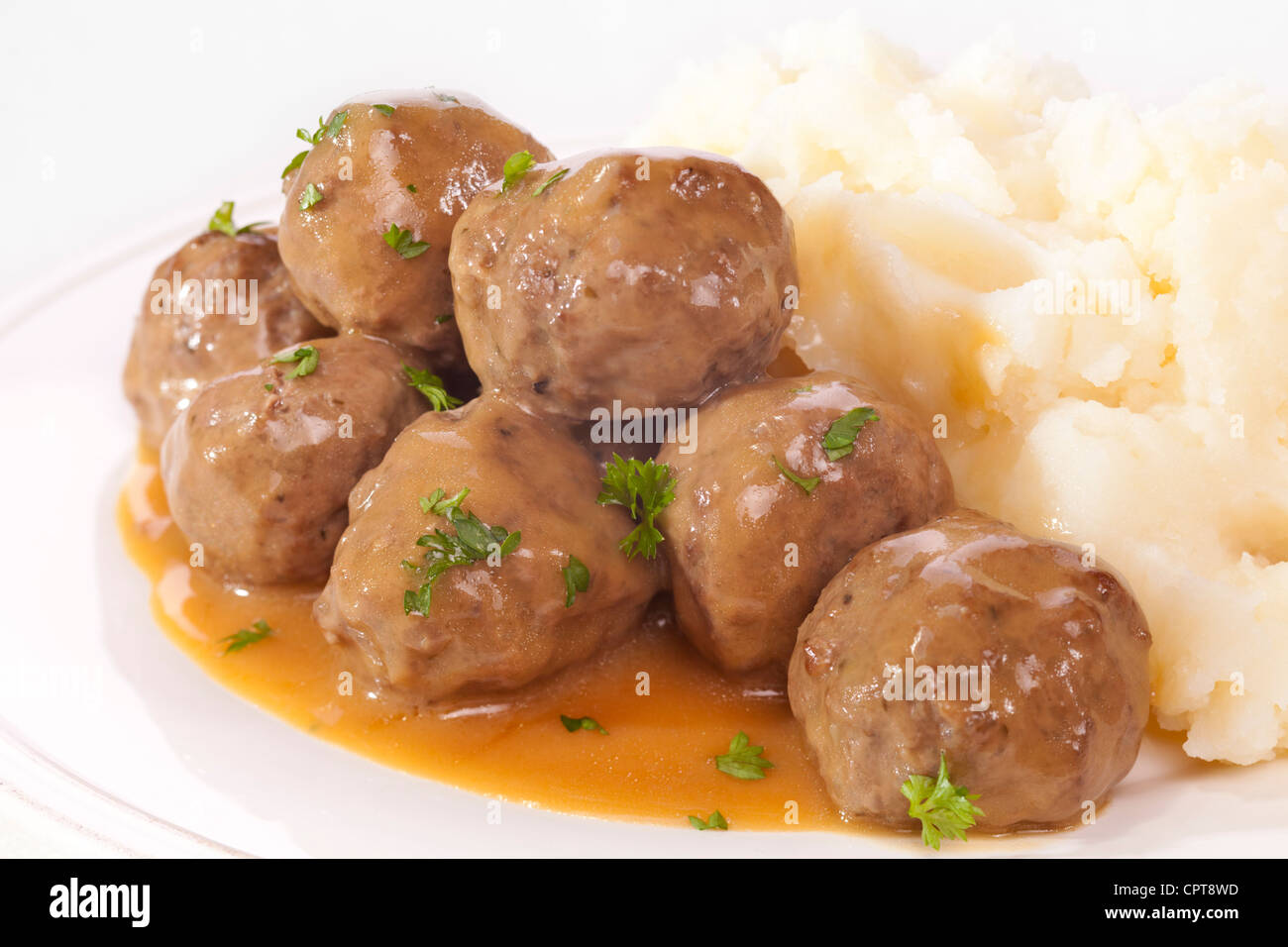 A plate of Swedish meatballs in cream sauce with mashed potato Stock ...