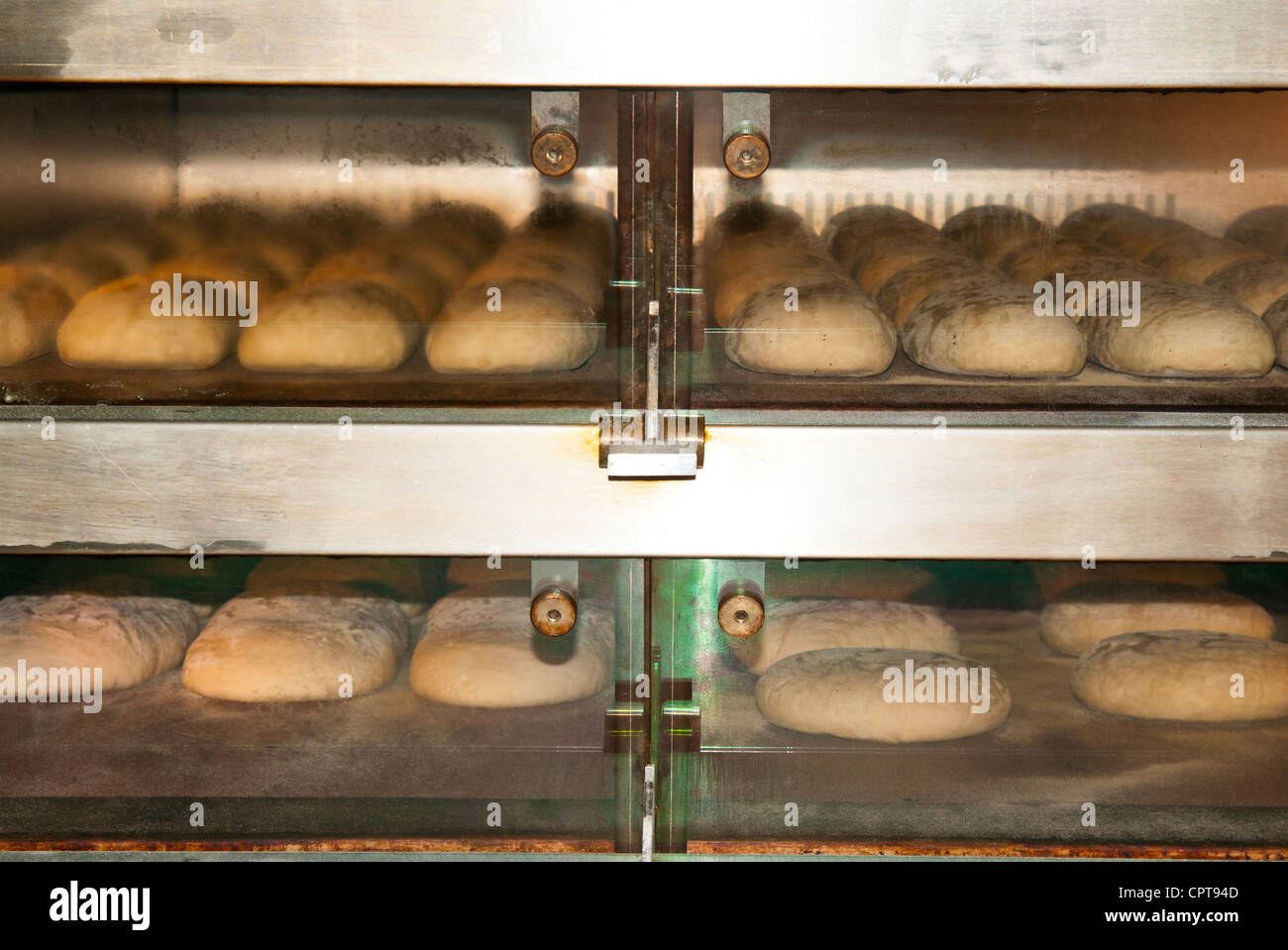 Bread cooking in the owen Stock Photo - Alamy