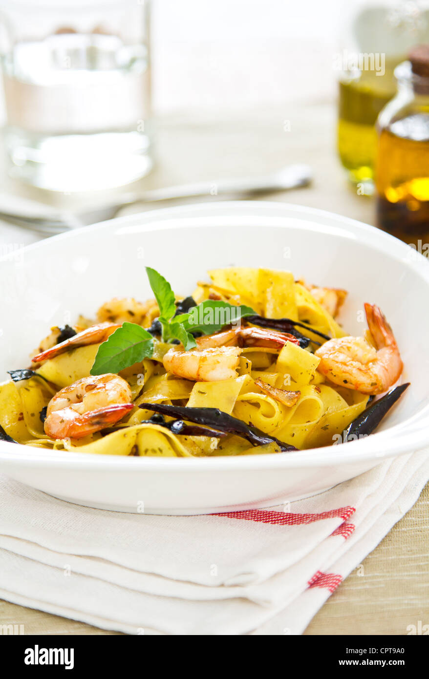 Tagliatelle with prawn and chili Stock Photo - Alamy