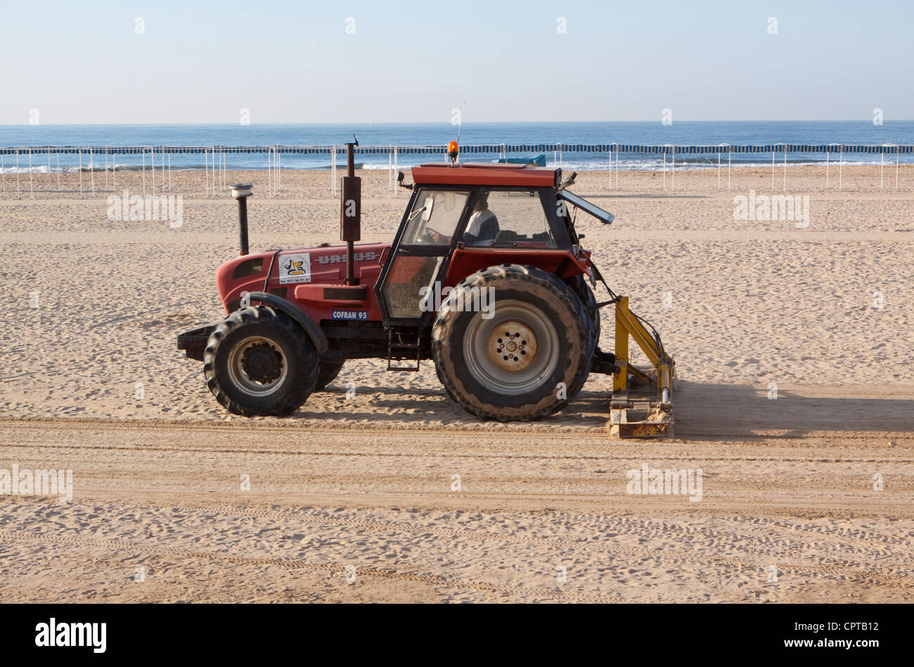 Tractor cleaning beach sand hi-res stock photography and images - Alamy