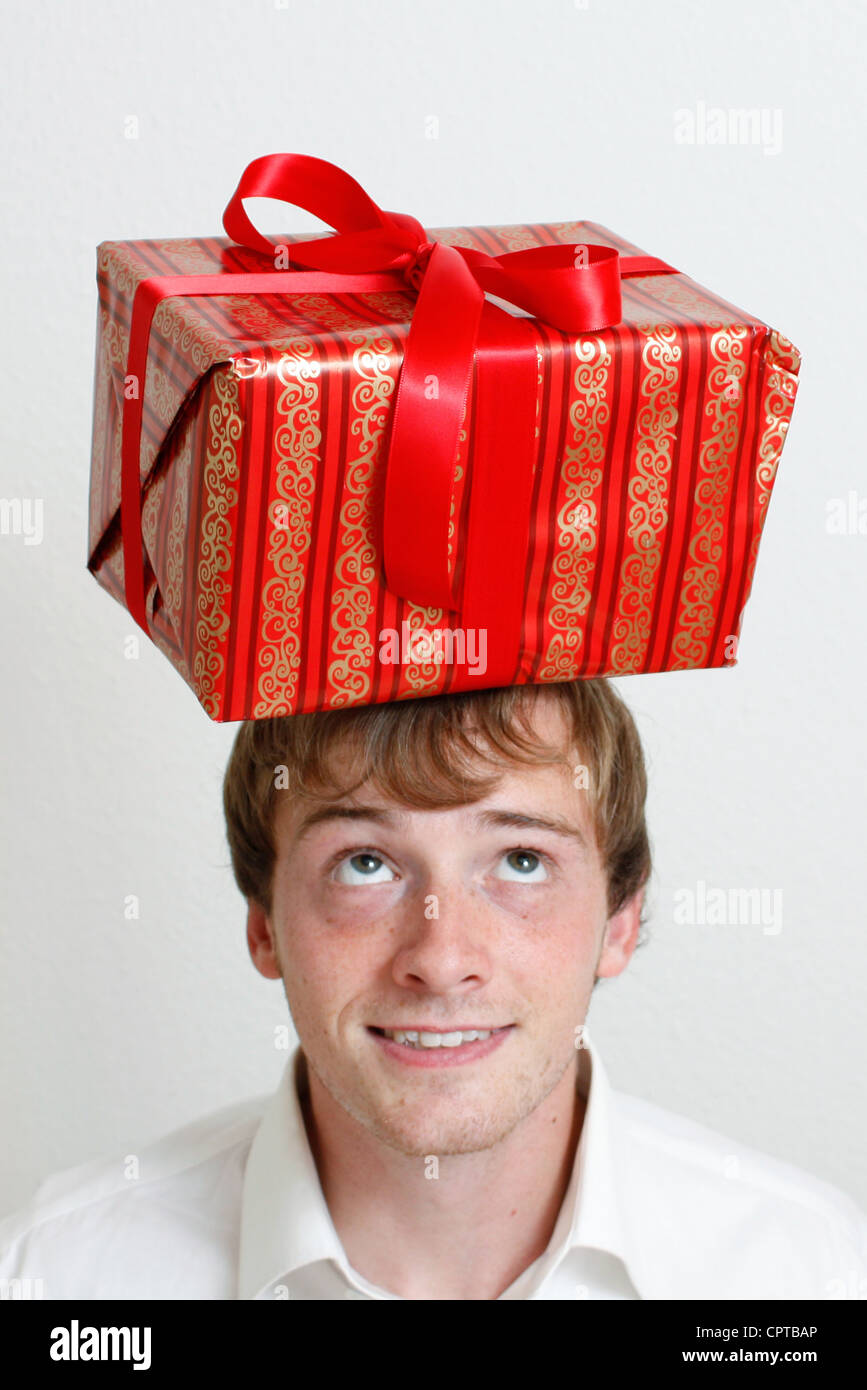 Christmas present on top of head Stock Photo - Alamy