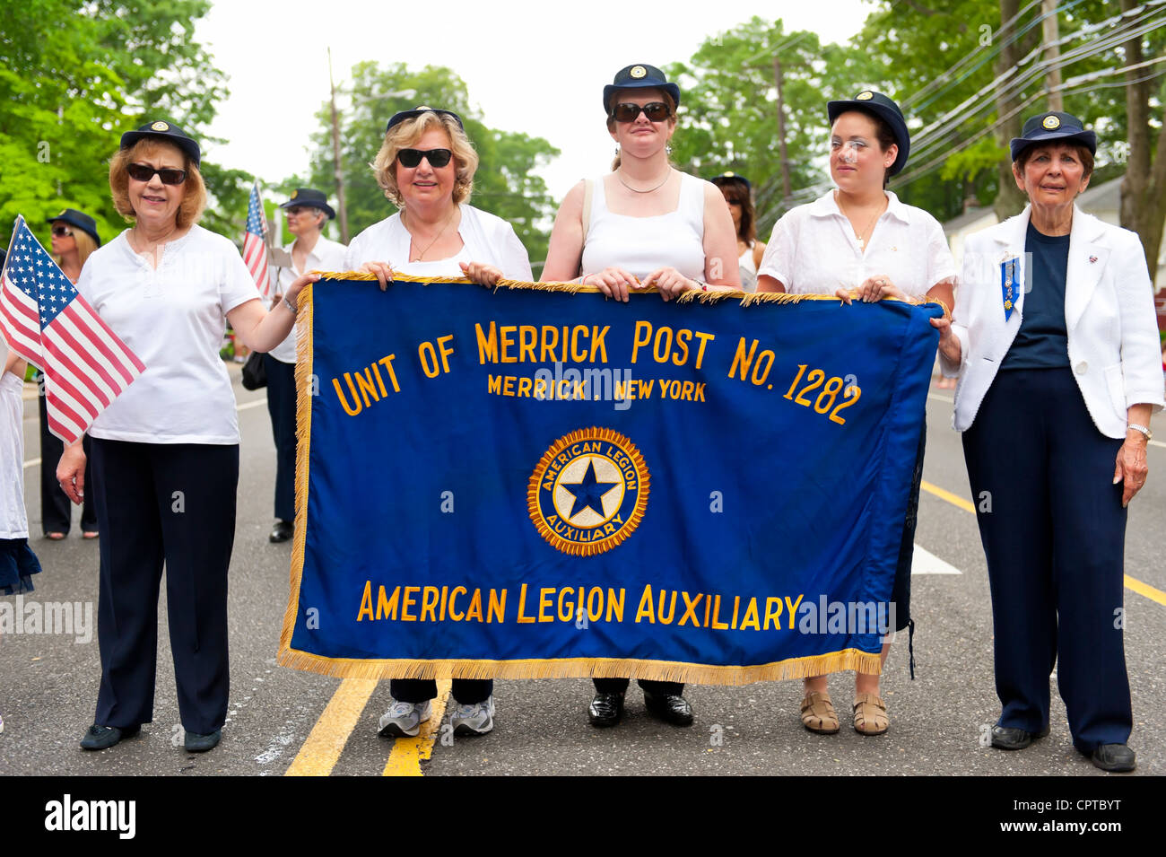 American Legion Auxiliary marching with banner in Merrick Memorial Day ...